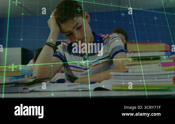 Teenage boy writing in classroom while green grid overlay scanning ...
