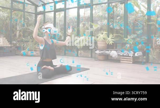 Woman with VR headset raising arms activating blue icons settling into ...