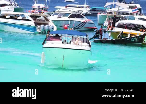 A speed boat moves through crowded Phuket marina Stock Video Footage ...