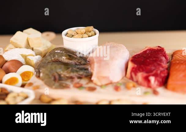 Variety of meats, nuts, and seafood arranged together Stock Video ...