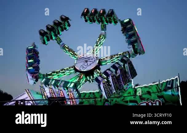 Amusement park ride spinning against sky Stock Video Footage - Alamy