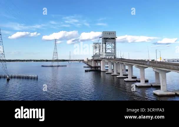 James River Lift Bridge JRB spans a calm waterway, supported by tall ...