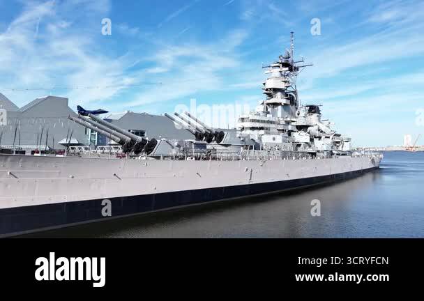 A historic Wisconsin BB-64 battleship sits docked at the harbor ...