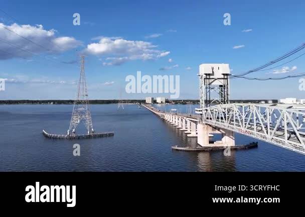James River Lift Bridge JRB spans a calm waterway, supported by tall ...