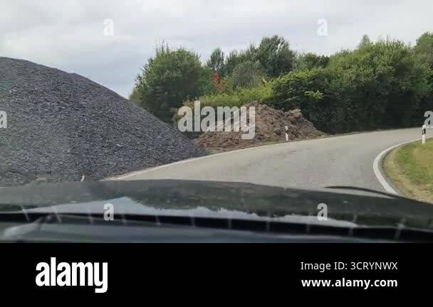 Point of view shot from a car approaching a closed road with a large ...
