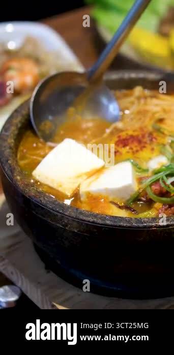 Korean Spicy Soft Tofu Stew Sundubu ,closeup shot. High quality 4k ...