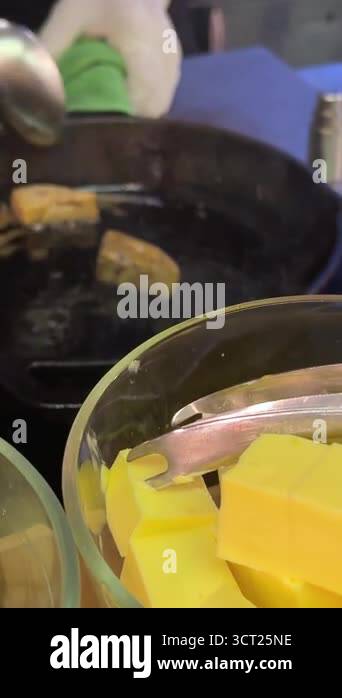 Cooking butter garlic fry pieces of fish meat in a frying pan. High ...