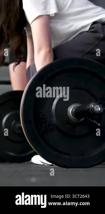 Weightlifting woman exercise Lifting barbell, woman in gym focusing on ...