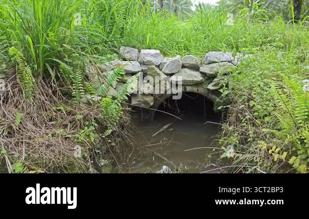 water flowing through rural canal irrigation and drainage system at the ...