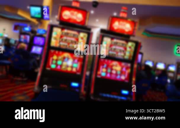 Defocused video of casino slot machines glowing with colorful lights ...