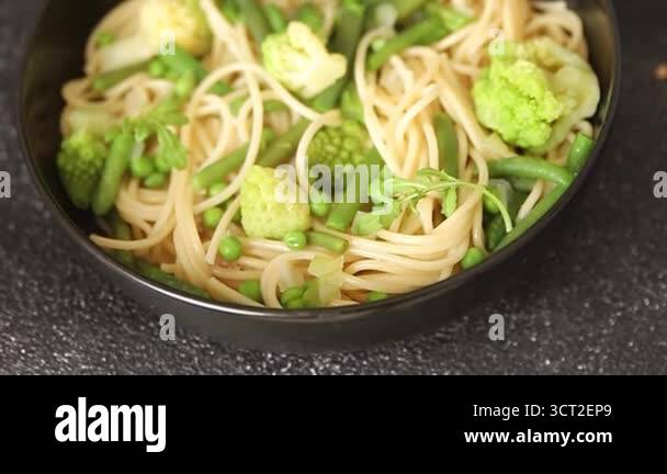 Spaghetti vegetables green peas, broccoli, string beans, kohlrabi ...
