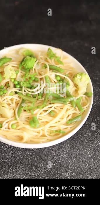 Spaghetti vegetables green peas, broccoli, string beans, kohlrabi ...