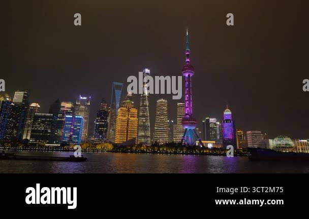 Shanghai Bund and Lujiazui illuminated at night, featuring iconic ...
