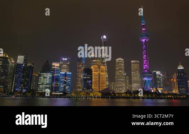 Shanghai Bund and Lujiazui illuminated at night, featuring iconic ...