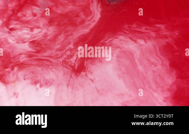 Color fluid mix. Marble paint. Defocused red white water splash liquid ...