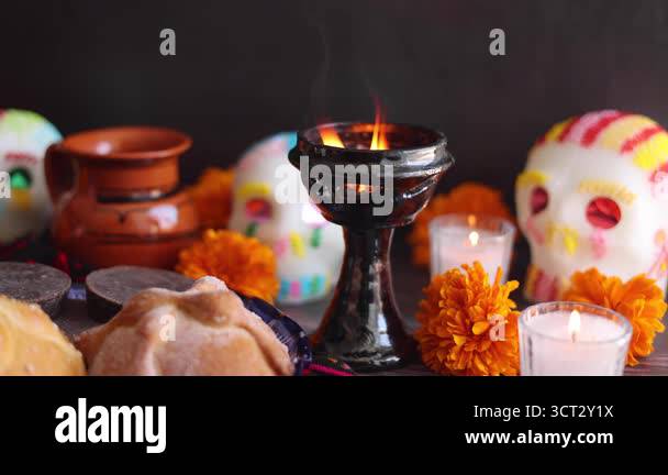 Mexican bread and burning and smoky incense on Altar with sugar skull ...