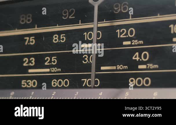 Extreme close-up shot of tuning vintage radio frequency dial, showing ...