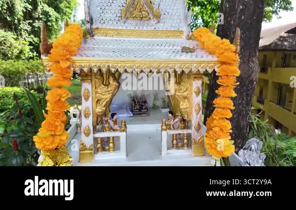 Buddhist altar with smoke from burning incense outside home, south east ...