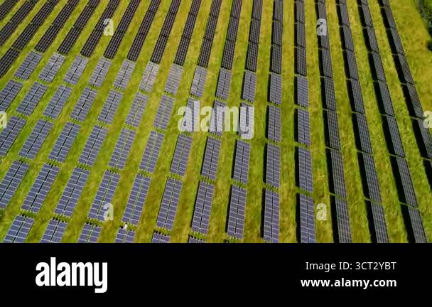 Aerial view of a solar powered energy farm in a countryside landscape ...
