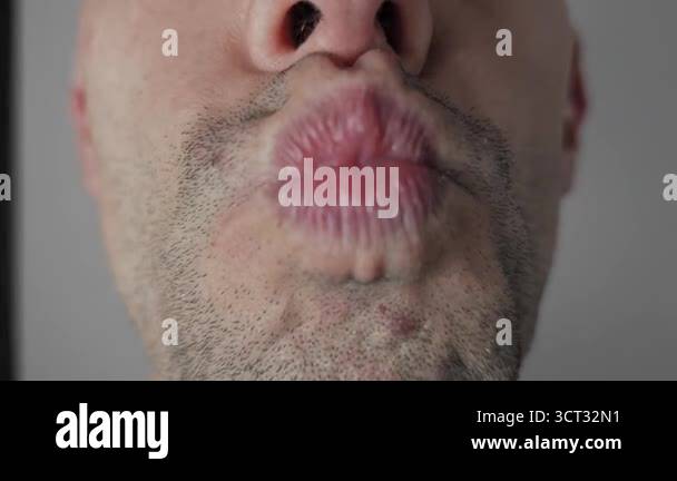 Extreme close-up of unshaven mans mouth laughing, showing a wide smile ...