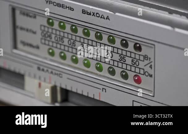 Extreme close-up of a vintage audio amplifier LED meter with Cyrillic ...