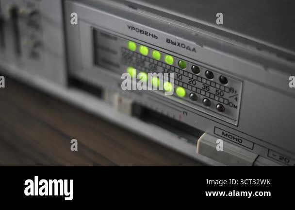 High-angle macro of a pulsing LED audio meter on a vintage USSR deck ...