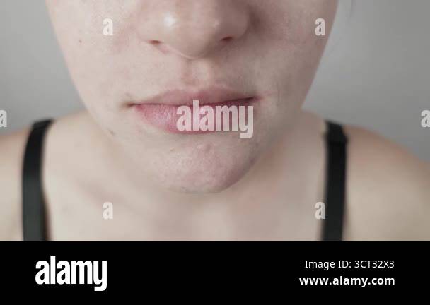 Extreme close-up on young womans mouth breaking into a wide, toothy ...