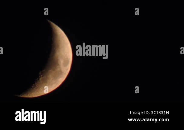 Extreme close-up telephoto shot of waxing crescent moon, showing ...