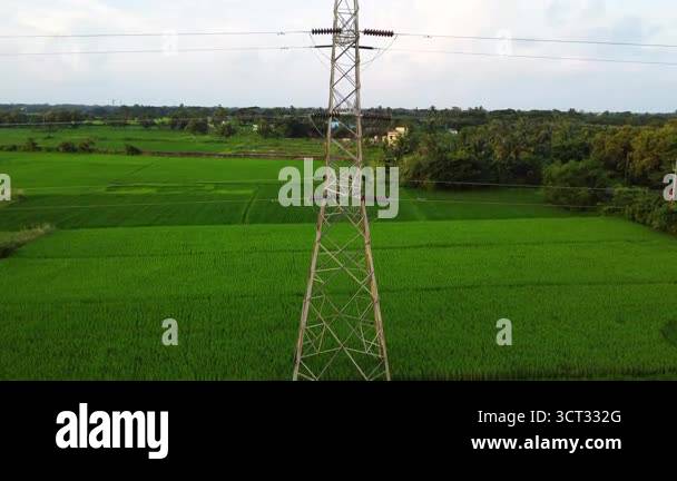 Transmission tower in rural INDIA. Aerial shot of power lines above ...