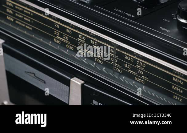 Wide macro shot of a radio tuner indicator scanning across the analog ...