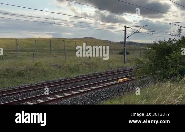 Scotland : Modern British passenger trains pass at speed through East ...