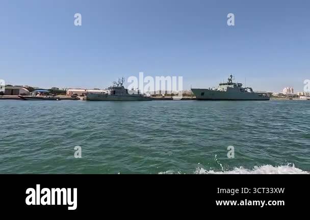 Warships docked at Lagos port, Portugal, with visible decks, hulls, and ...
