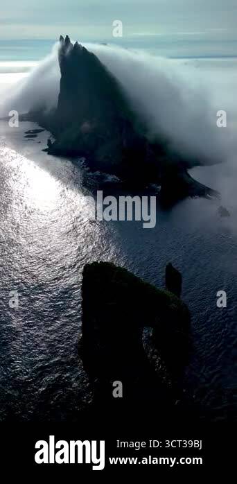 Experience the breathtaking beauty of Drangarnir Cliff, rising ...