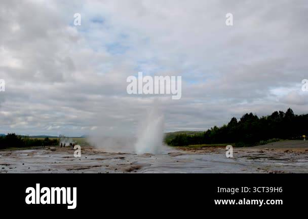 Witness the powerful eruption of Strokkur Geyser, sending steaming ...