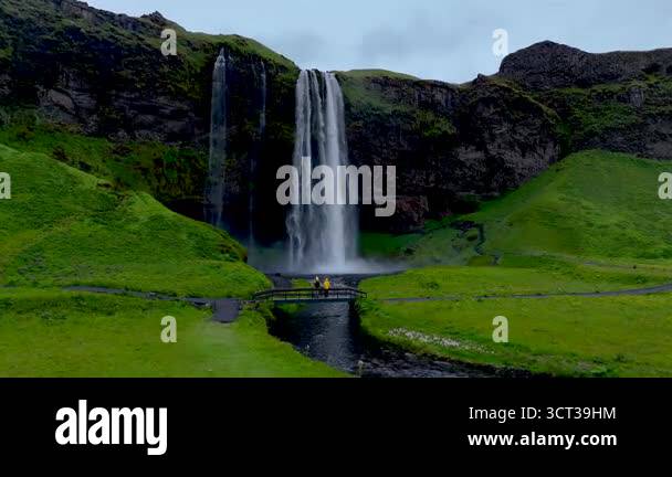 Experience the breathtaking Seljalandsfoss waterfall in Iceland, where ...
