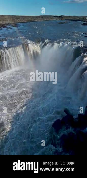 Witness the raw power of Selfoss waterfall roaring as it cascades into ...