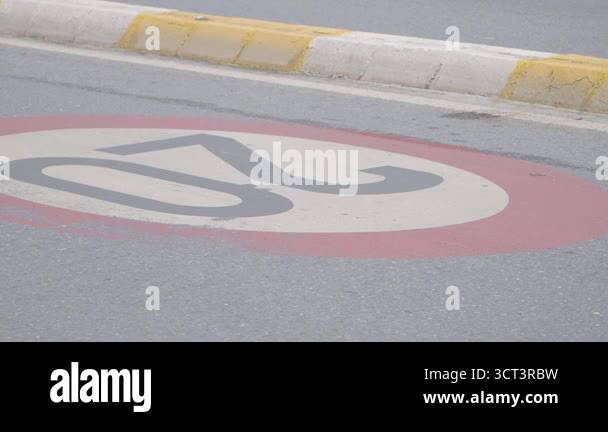 Speed limit sign marking on the road in a busy area Stock Video Footage ...