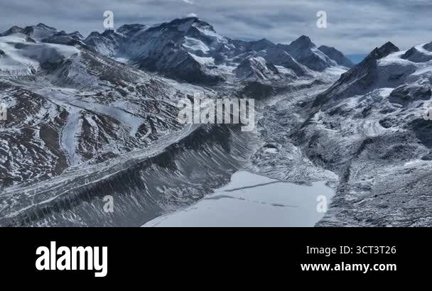 A majestic view of a vast, snow-covered mountain landscape with ...