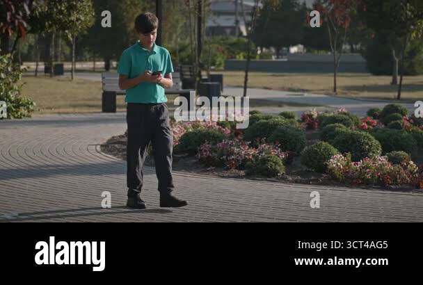 Teenage Boy Walk in Park 4K 10-bit 60fps Slow motion Stock Video ...