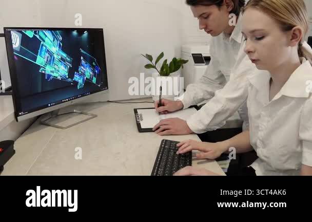 People collaborate online via a computer. Typing on a keyboard, writing ...