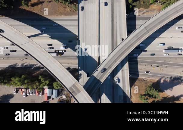Aerial top-down drone footage of a busy freeway interchange in Los ...