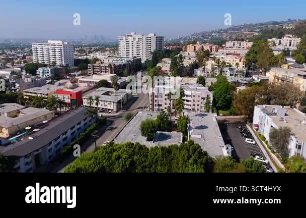 Drone footage flying forward over residential streets and apartment ...