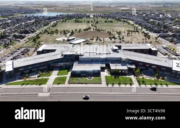 4K aerial view of Stonebridge in Saskatoon, showing modern homes, parks ...