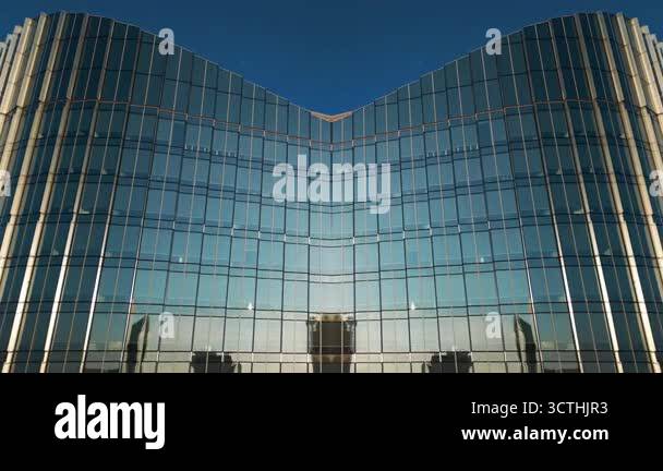 mirrored fractal effect of modern tall skyscraper glass building and ...