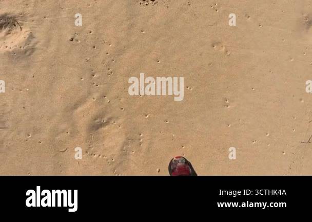 Footsteps on sand during a beach walk Stock Video Footage - Alamy