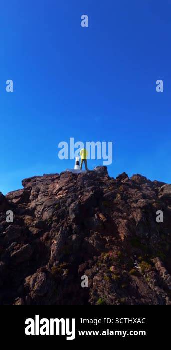 Hiker Man in Yellow Jacket on Top of Mount Pico above Clouds on Sunny ...