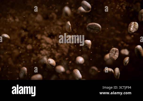 Super Slow Motion Shot of Ground Coffee and Fresh Beans Explosion ...