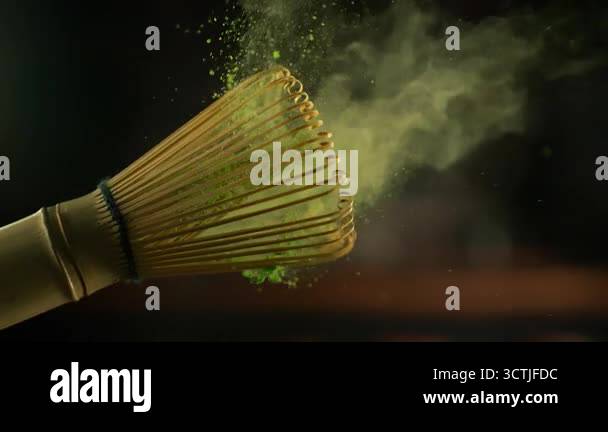 Super Slow Motion Shot of Flying Matcha Powder From Chasen Whisk with ...
