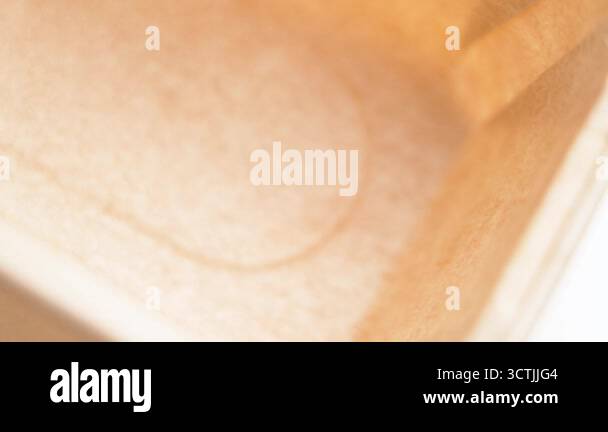 Fresh green onion stalks falling into a cardboard packaging. Spring ...