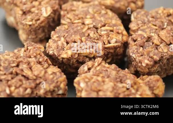 Easy preparation of tasty oat snacks using chocolate and nuts Stock ...